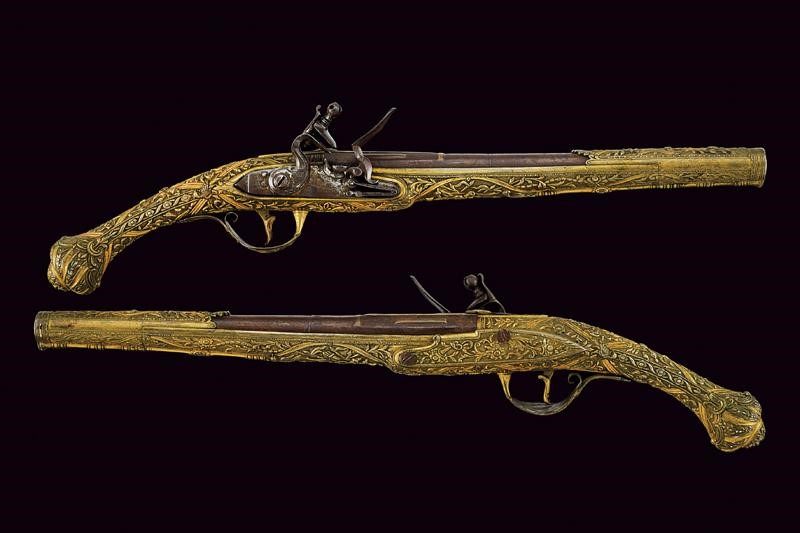A fine pair of flintlock pistols with carved mounts Early 19th Century ...