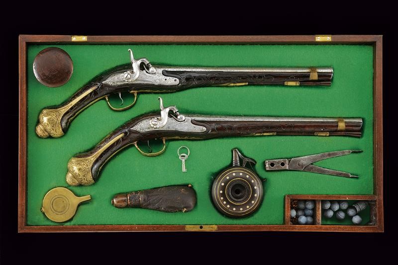 A pair of cased pistols converted to percussion First half of the 19th ...