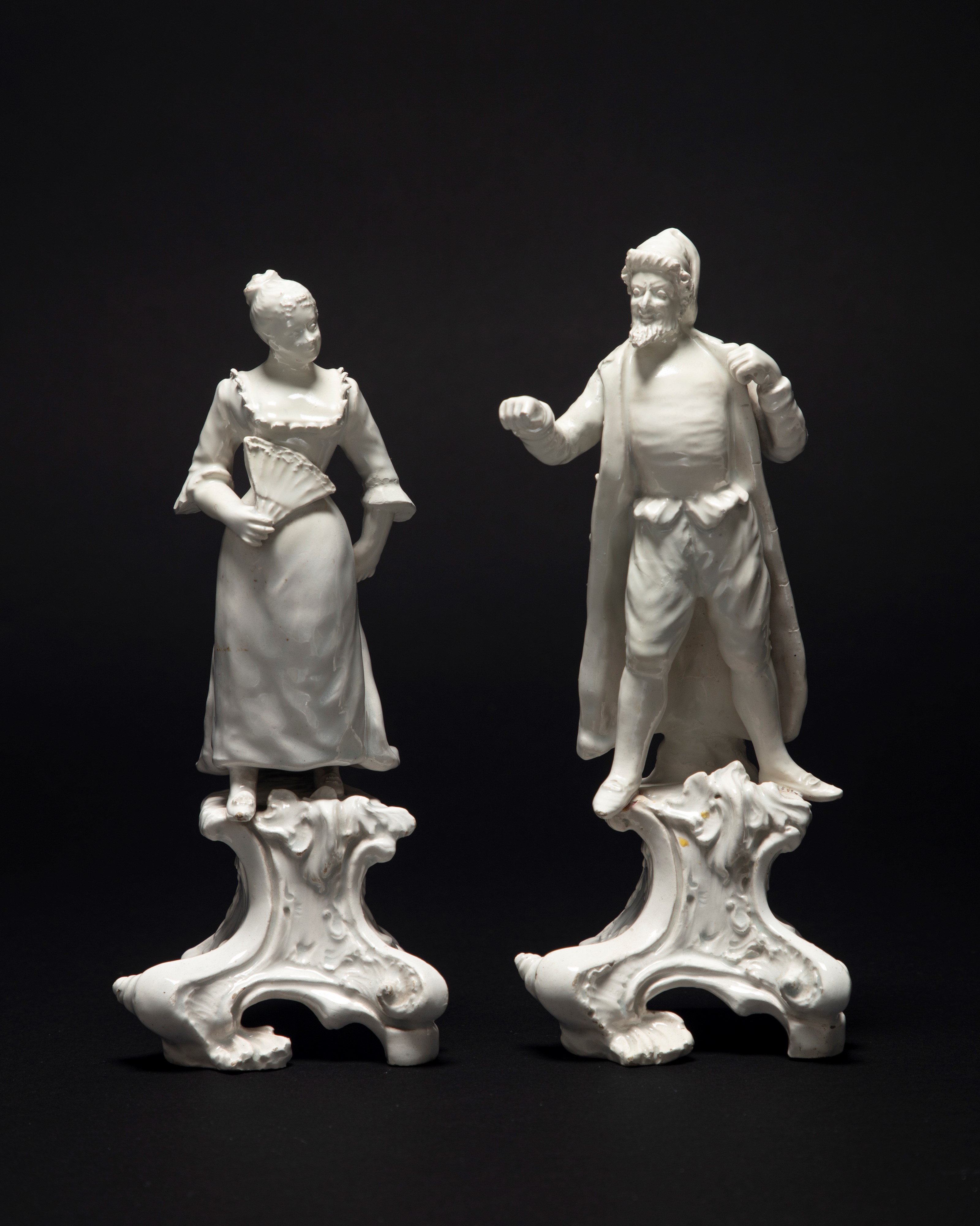 Two enameled earthenware figures depicting a gentleman and a lady with ...