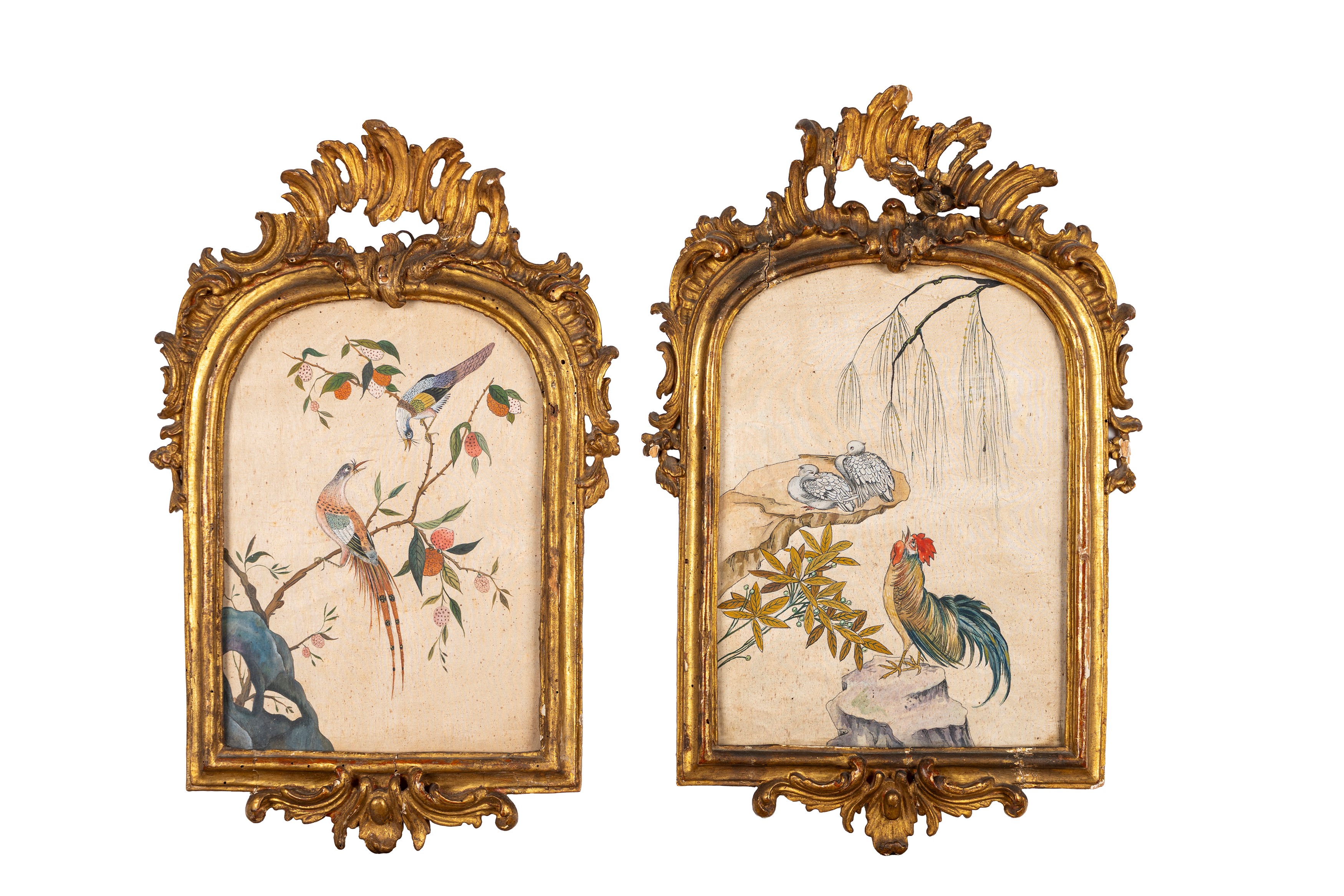 A pair of carved and gilded wooden frames with leafy scroll friezes and ...