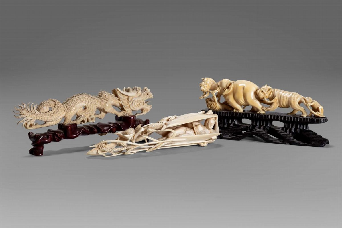 Lot of three ivory sculptures: a dragon, a shell with a female figure ...